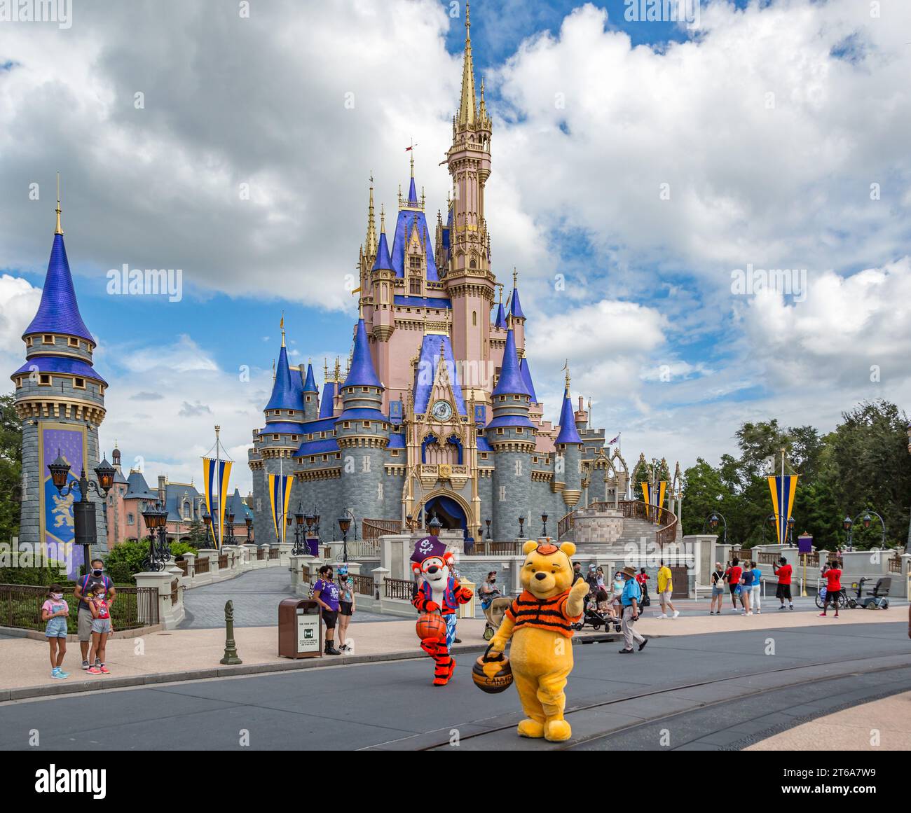Winnie the Pooh and Tigger walk past Cinderella's Castle at the end of ...