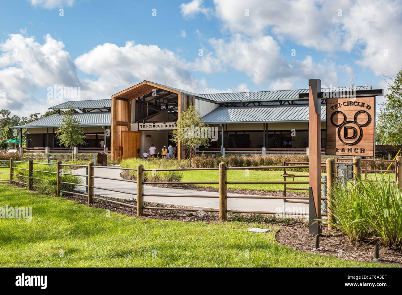 Family entering the Tri-Circle-D Ranch horse stables in the Fort ...