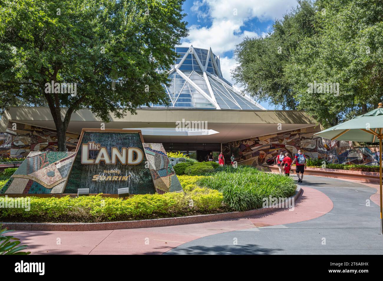 Family entering The Land attraction in Epcot at Walt Disney World in ...