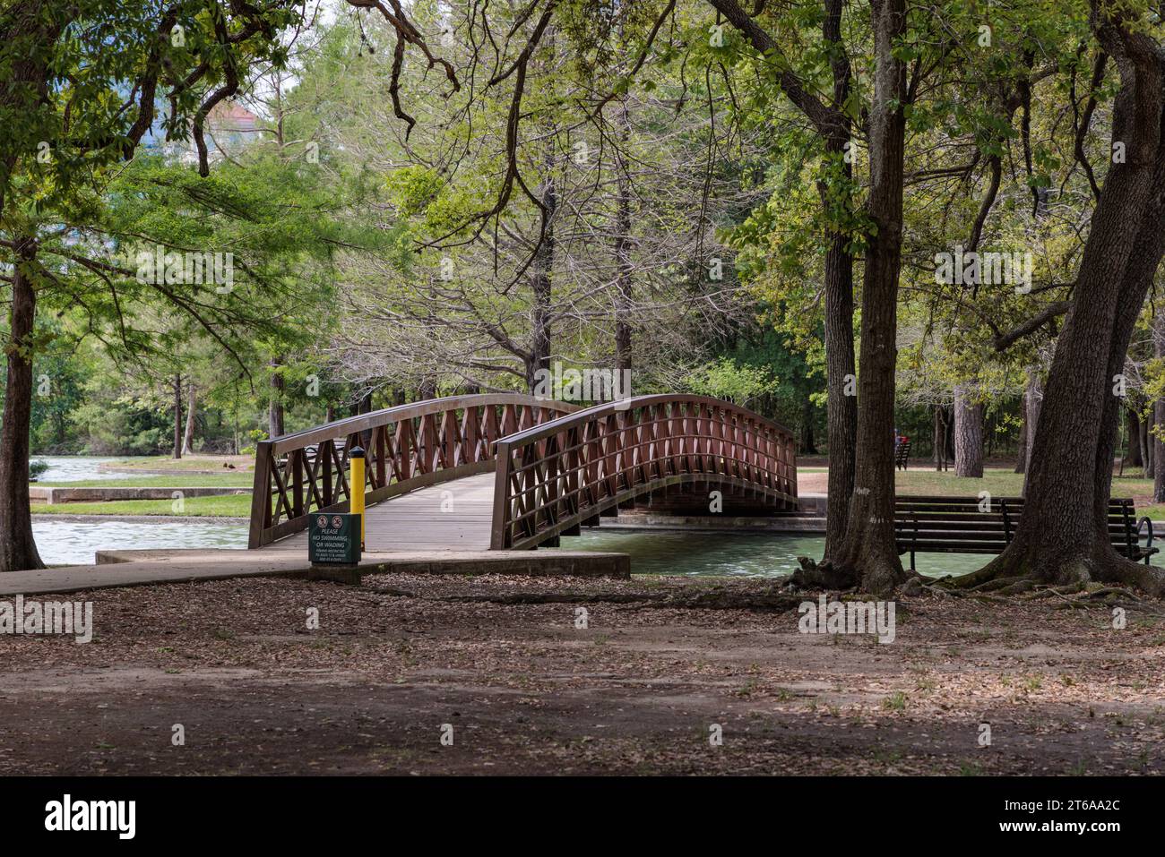 Pedestrian bridge over a part of McGovern Lake in Hermann Park in ...