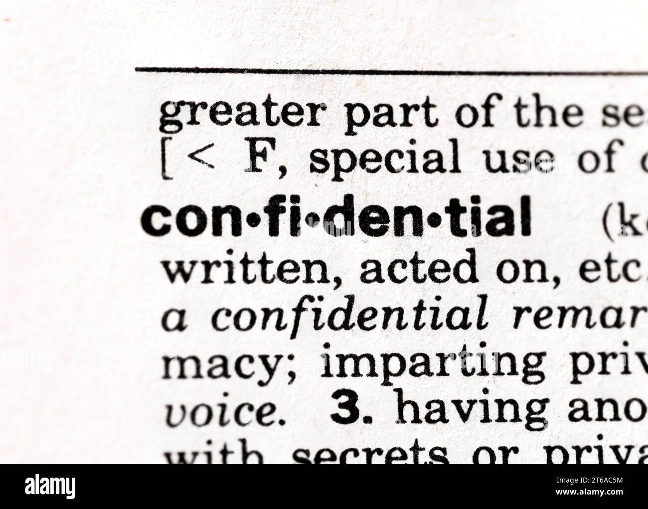 Closeup dictionary definition of the word confidential Stock Photo - Alamy