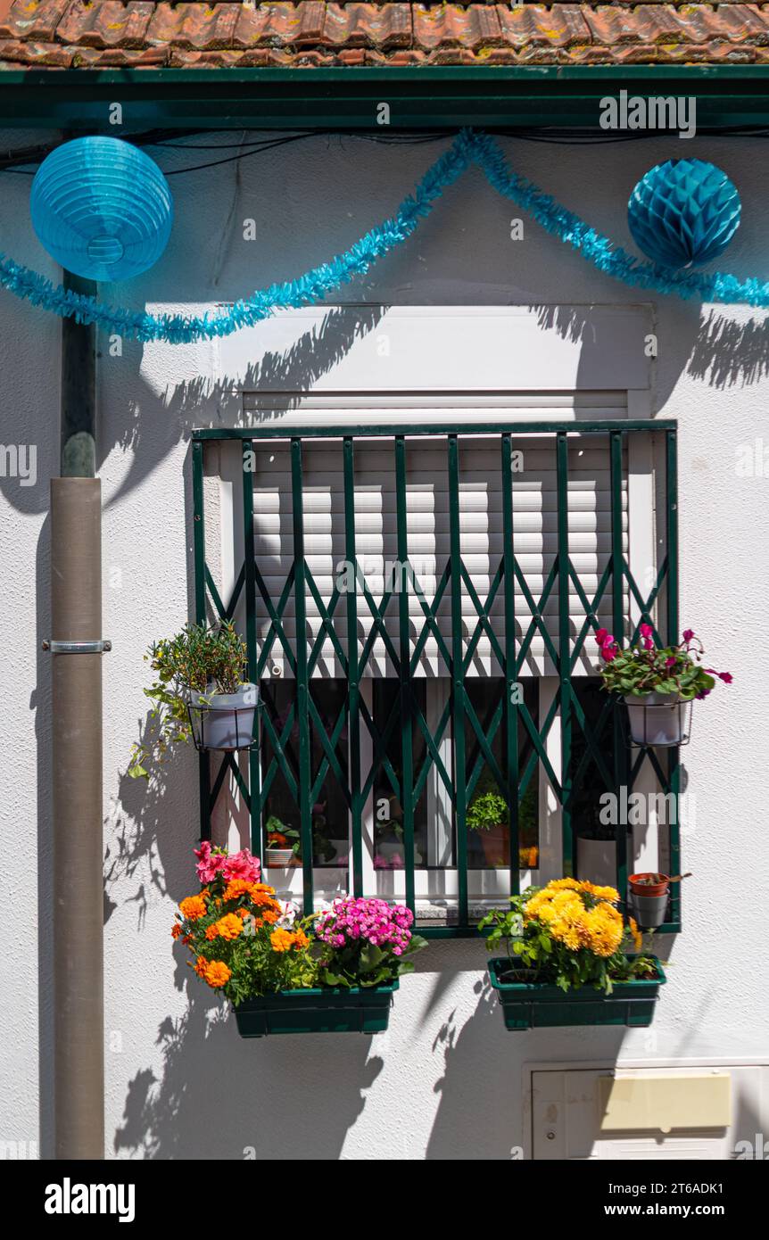 window in Porto city with San Juan festival decorations Stock Photo - Alamy