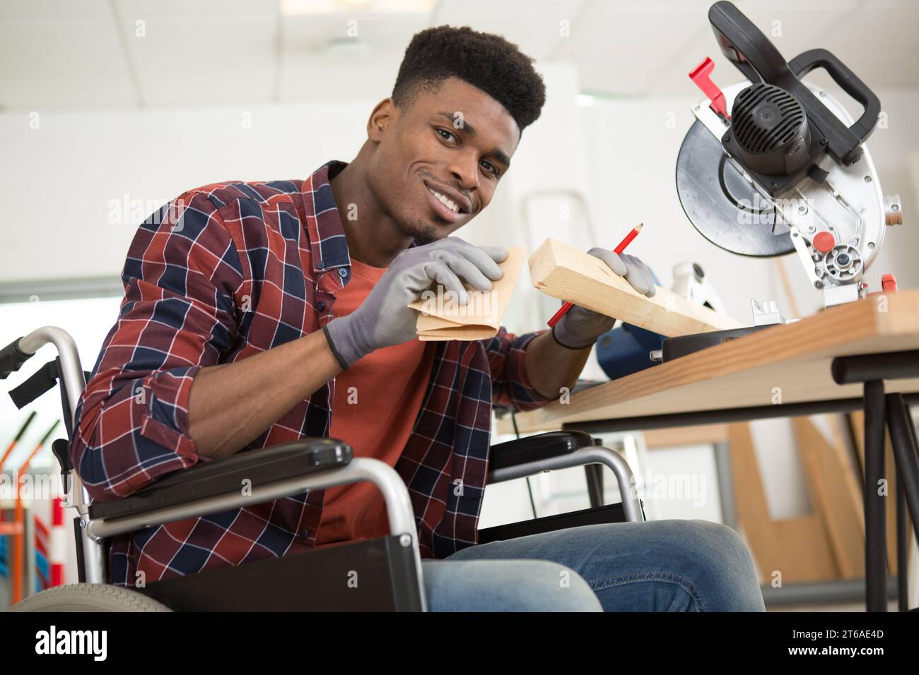 disabled man working with circular saw Stock Photo - Alamy
