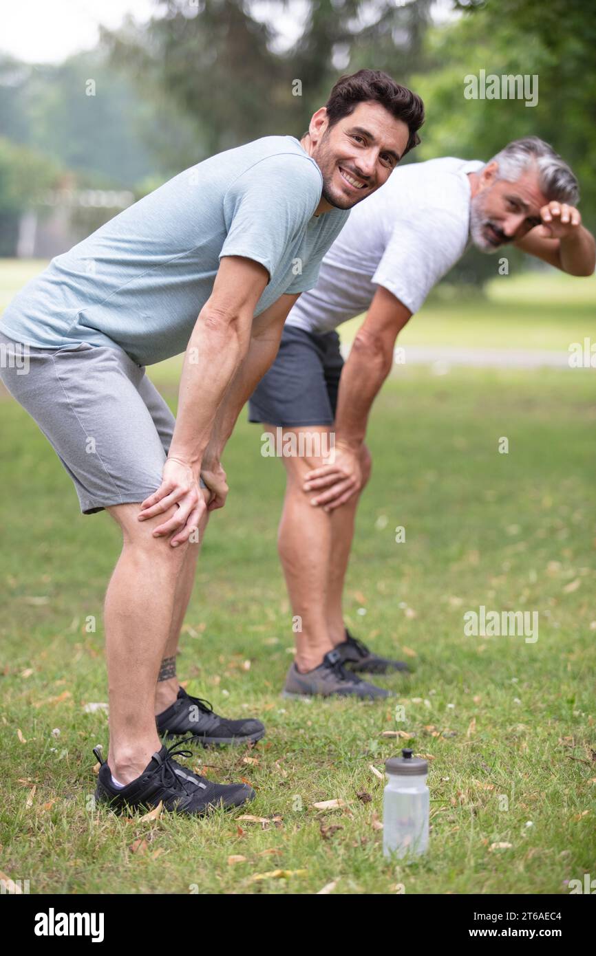 two men runners standing talking after running Stock Photo - Alamy