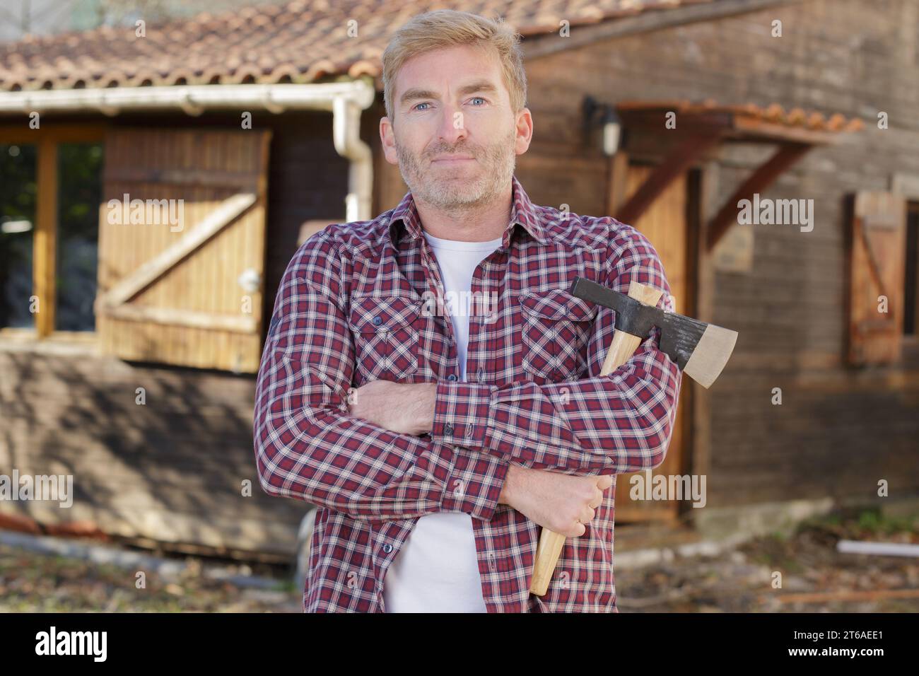 confident man standing with axe outdoors Stock Photo - Alamy