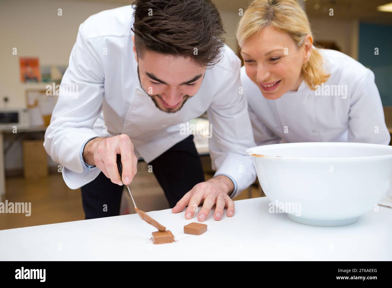 chef cook pouring chocolate during production process Stock Photo - Alamy