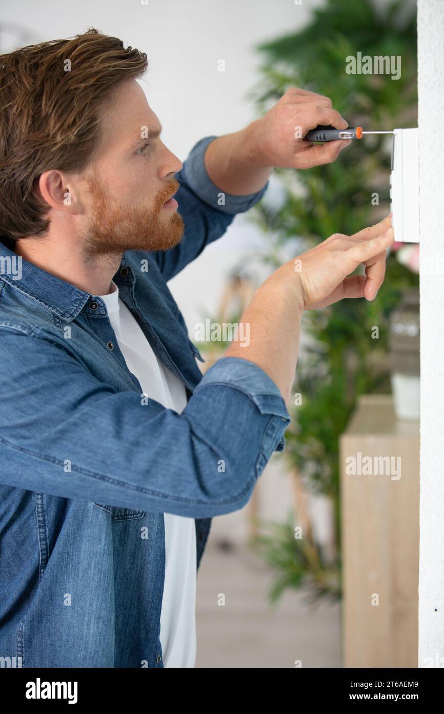 man is doing electrical wiring Stock Photo - Alamy
