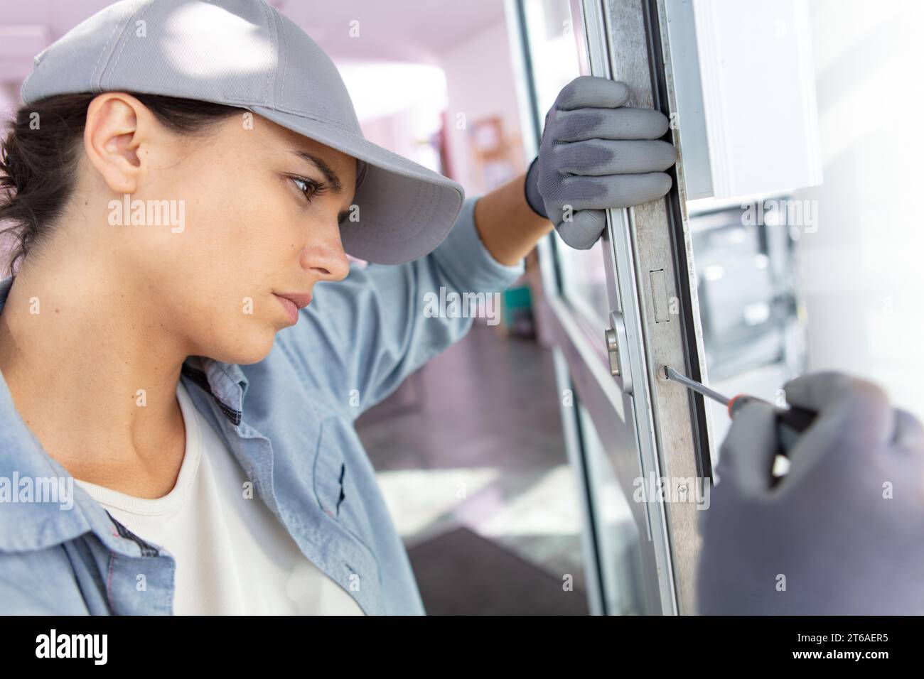 window setter inspecting the window Stock Photo - Alamy