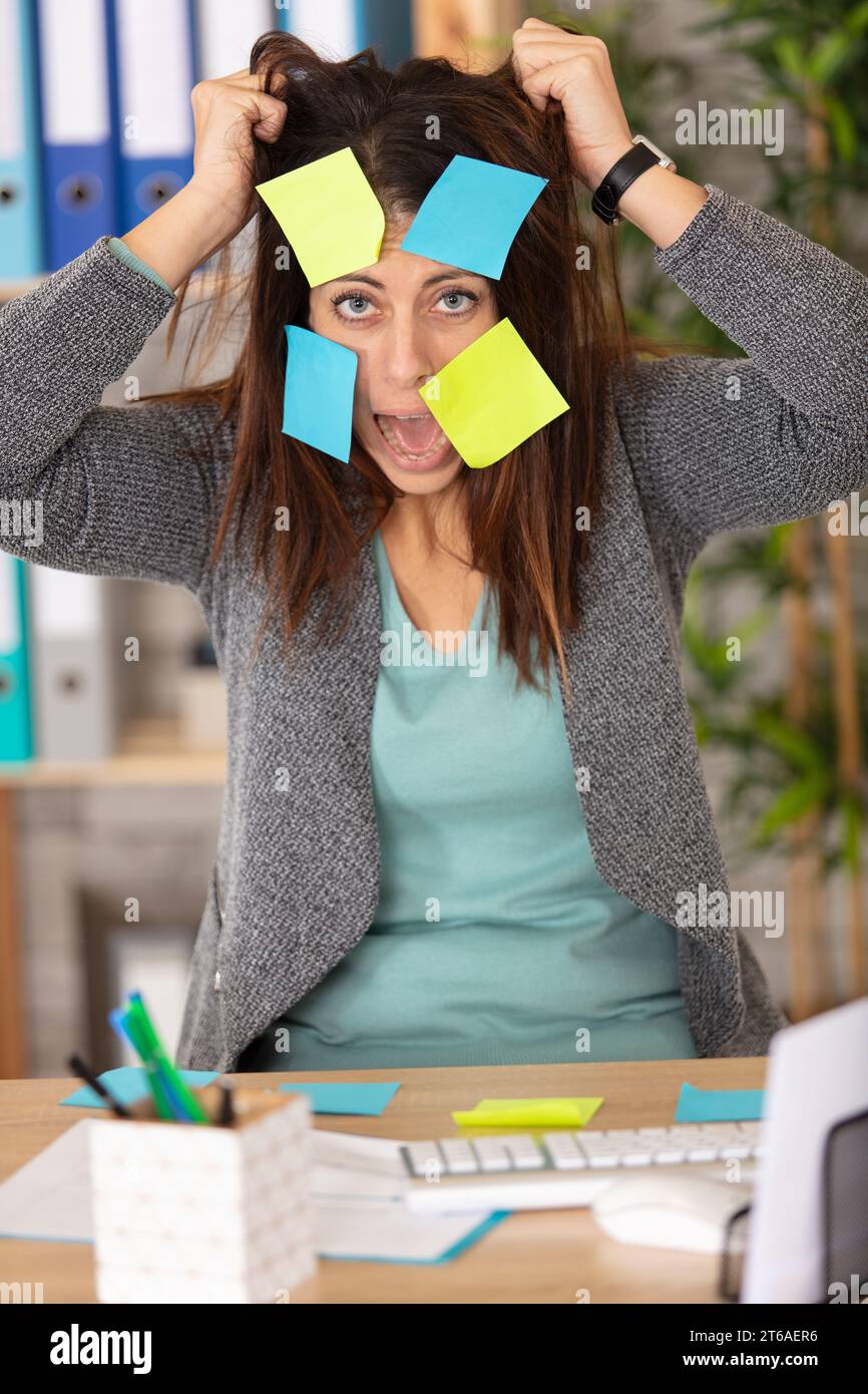 beautiful woman with stress and post it papers Stock Photo - Alamy