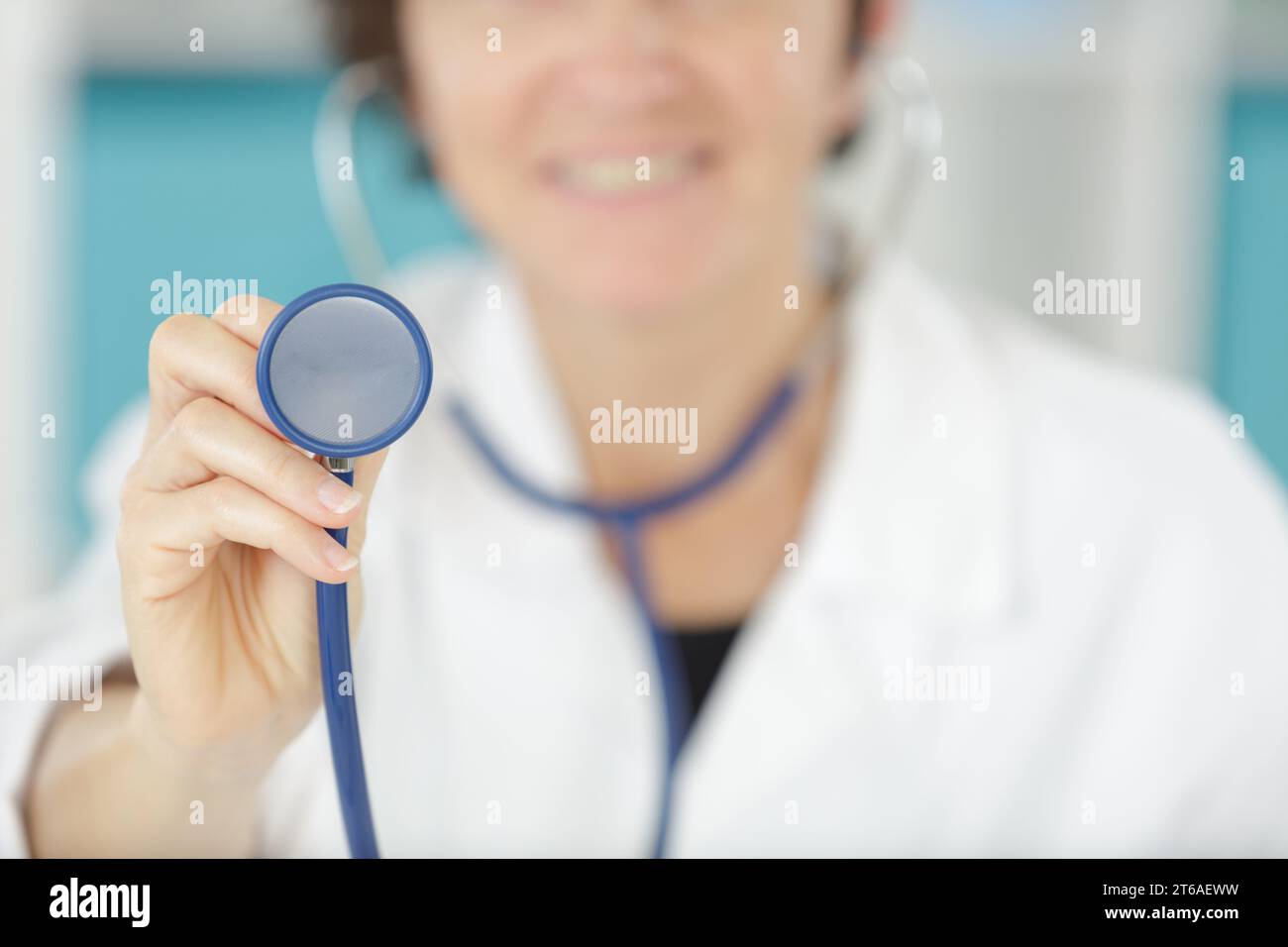 a female doctor using a stethoscope Stock Photo - Alamy