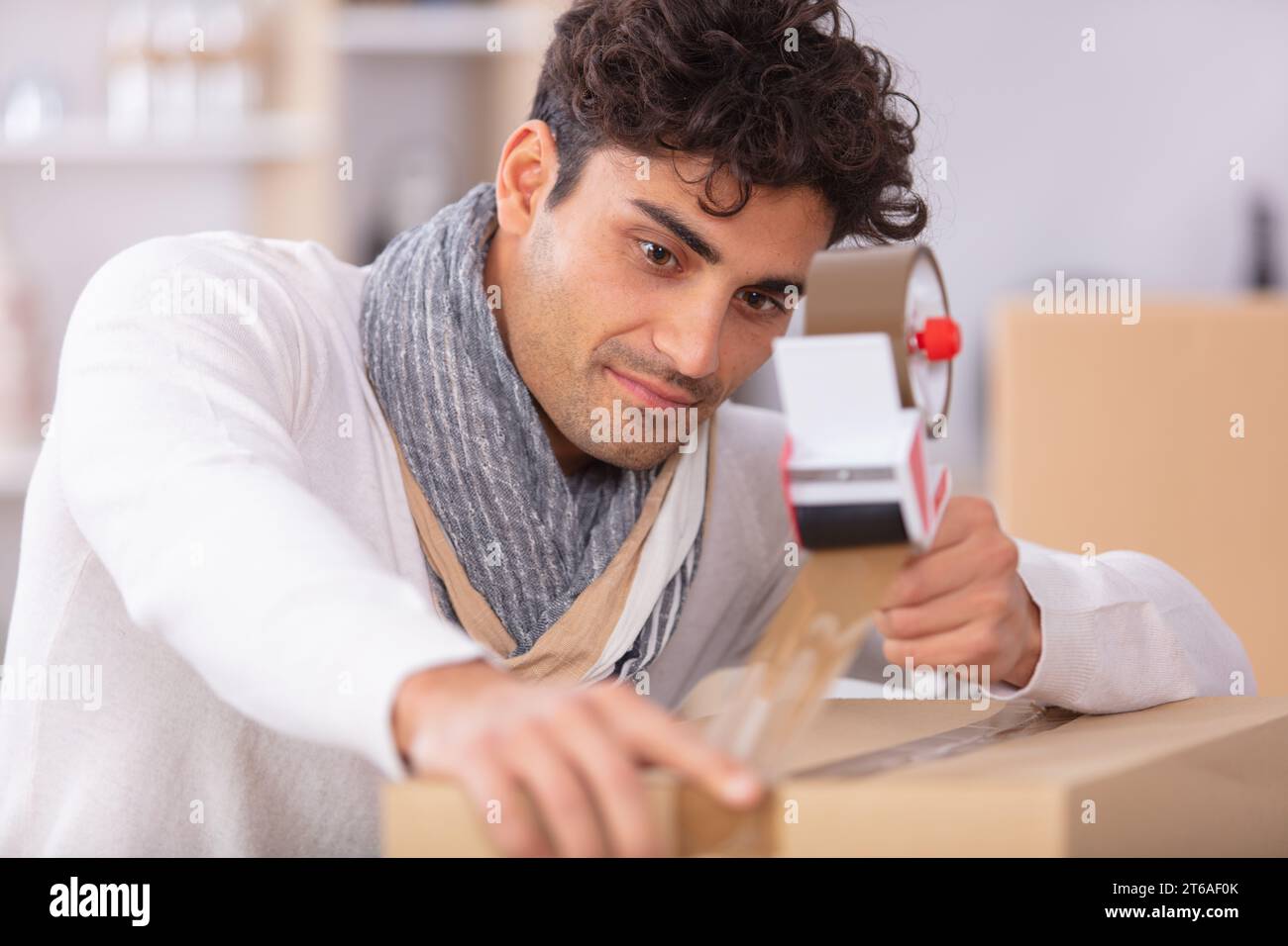 Man using dispenser adhesive tape hi-res stock photography and images ...