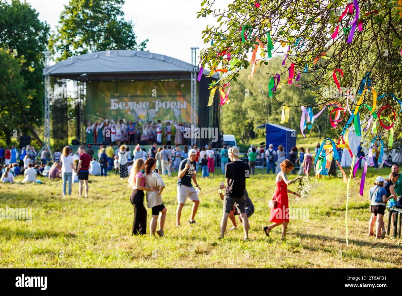 A wish tree hung with colored ribbons at a festive festival in honor of ...