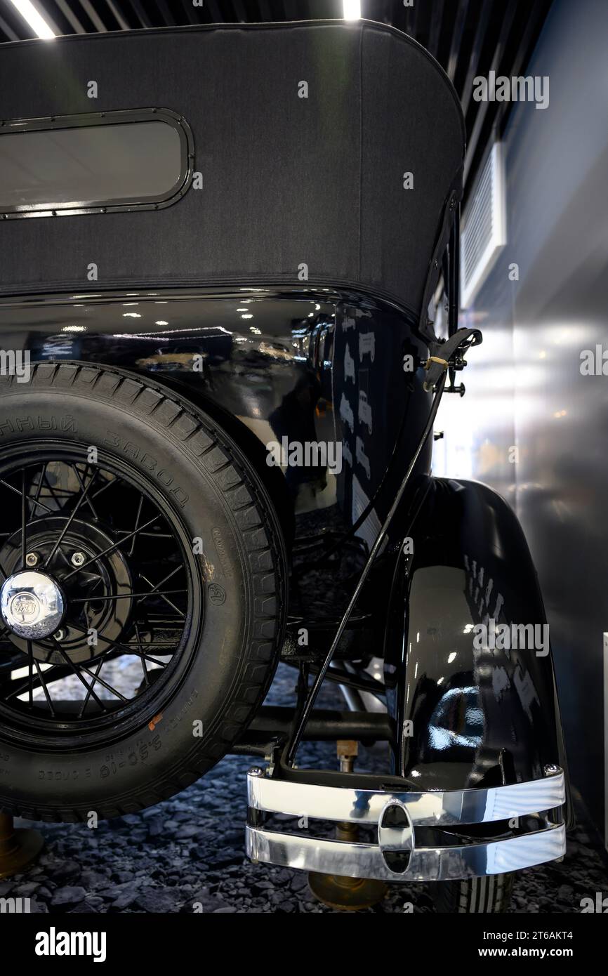 A fragment of the black lacquer body of the famous Soviet passenger car ...