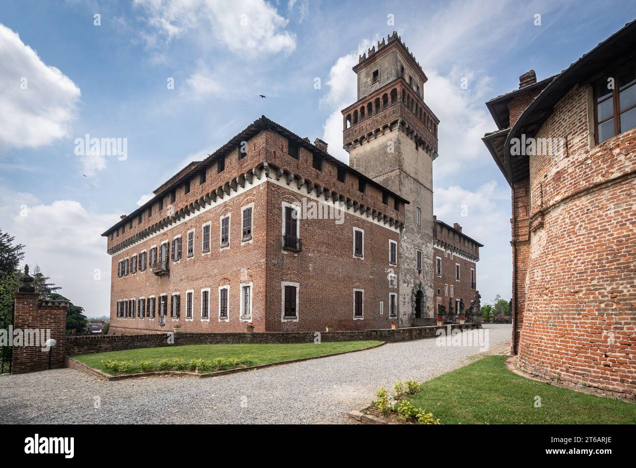 A rustic brick structure situated in a scenic Italian castle grounds ...