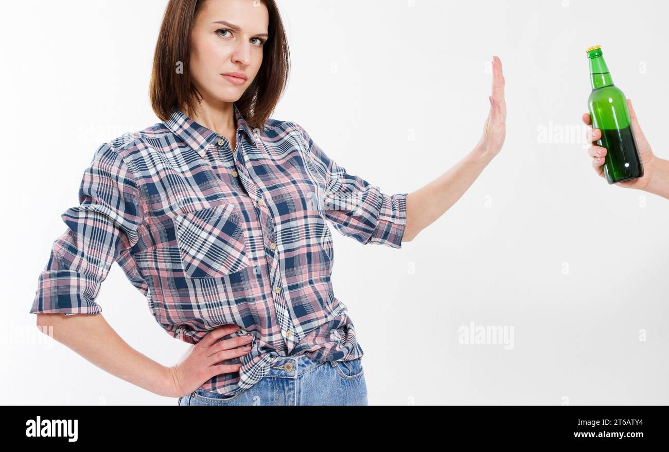 No alcohol concept - female addiction, girl rejection bottle of beer ...