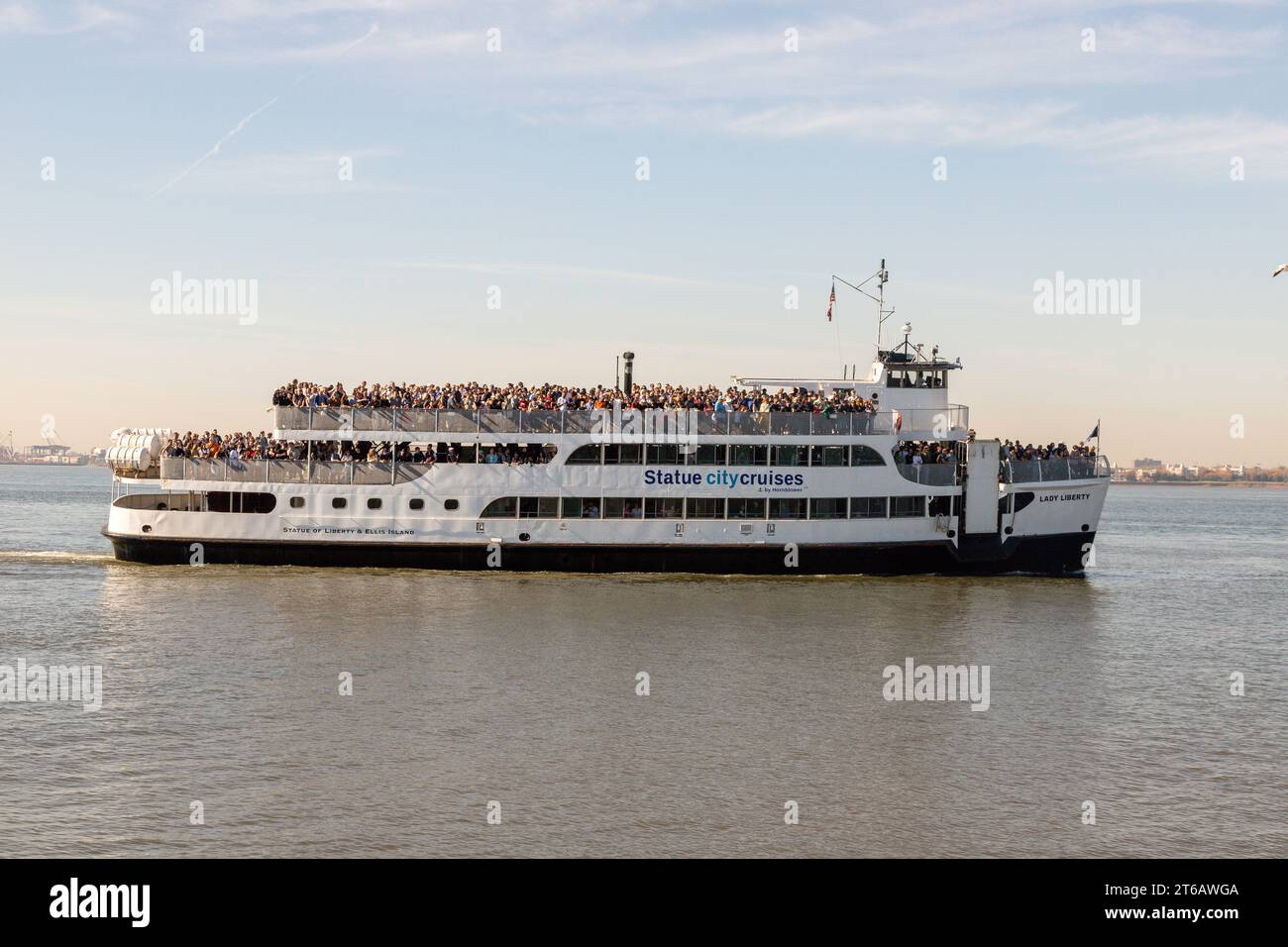 Statue Cruises passenger ferry Lady Liberty. Transporting tourists to ...