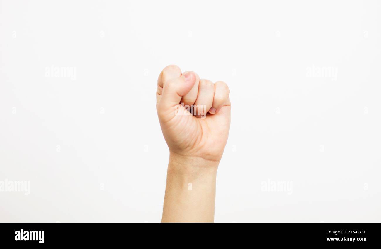 fist on white, hand with fist above on white background,selective focus ...