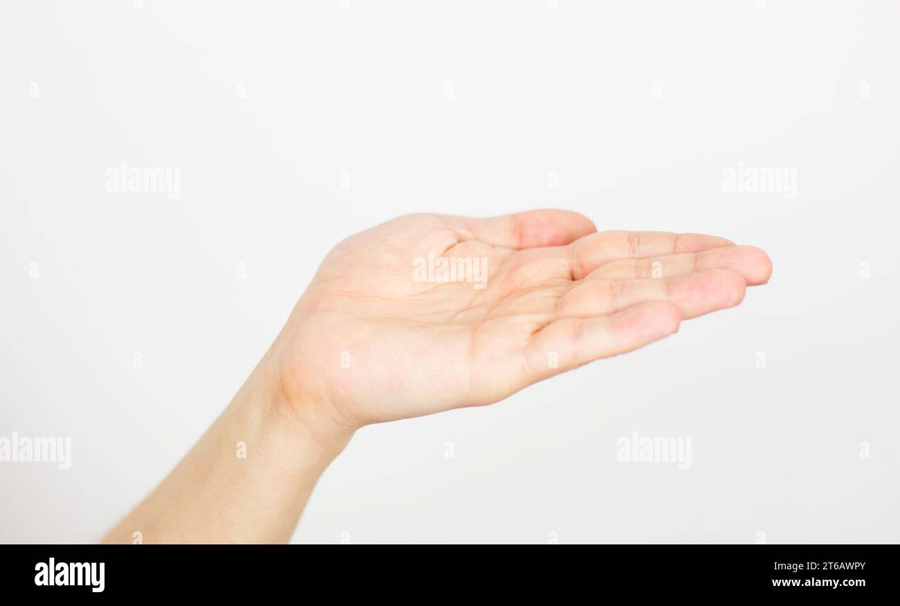 Open palm hand gesture of male hand - selective focus , woman's hand ...