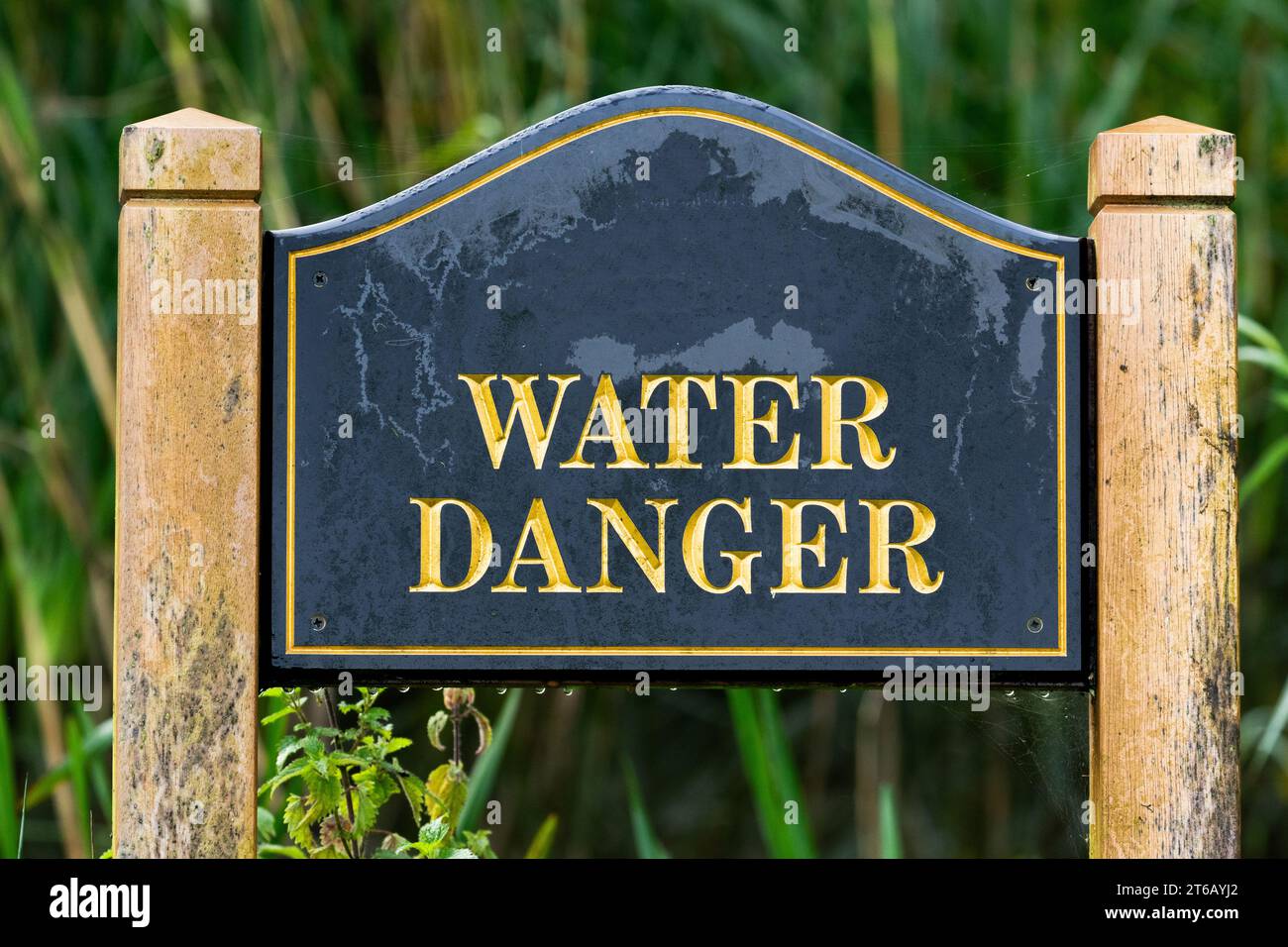 Gold lettering warning sign hi-res stock photography and images - Alamy