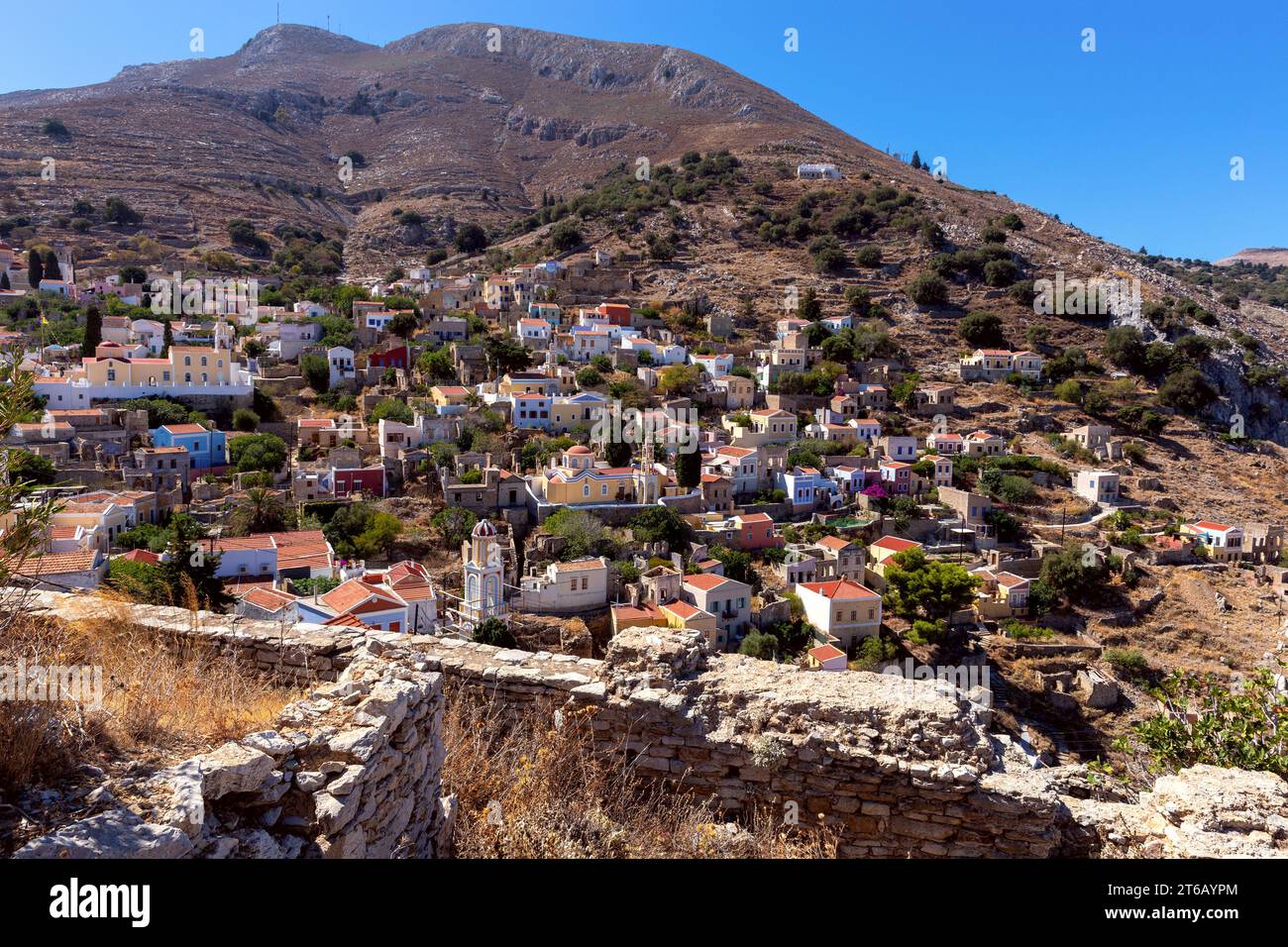 Aerial view of mountains and colorful traditional multi-colored houses ...