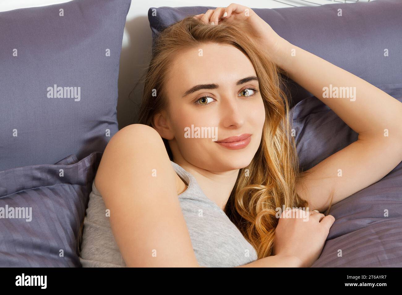 portrait of a beautiful smile girl on the bed after sleep Stock Photo ...