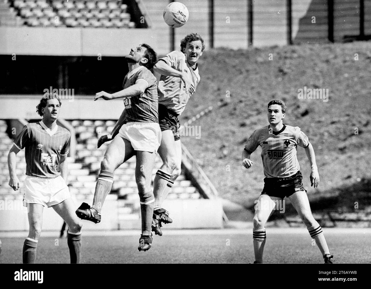 WOLVES V LINCOLN 2/5/87 Wolves Barry Powell and Peter Daniel in the air with Rob Kelly watching ...