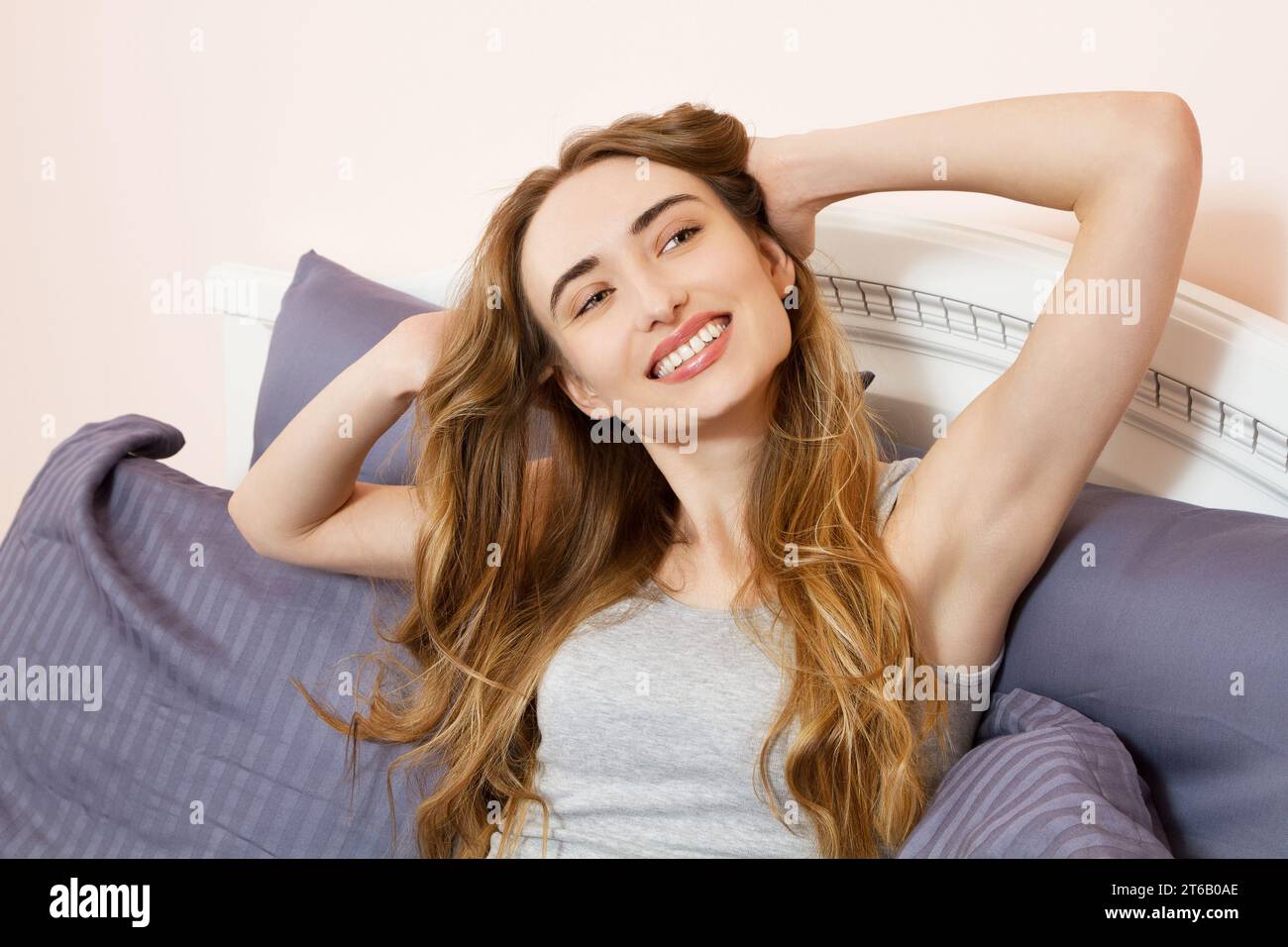 Picture of happy beautiful woman stretching in the morning, cute girl ...