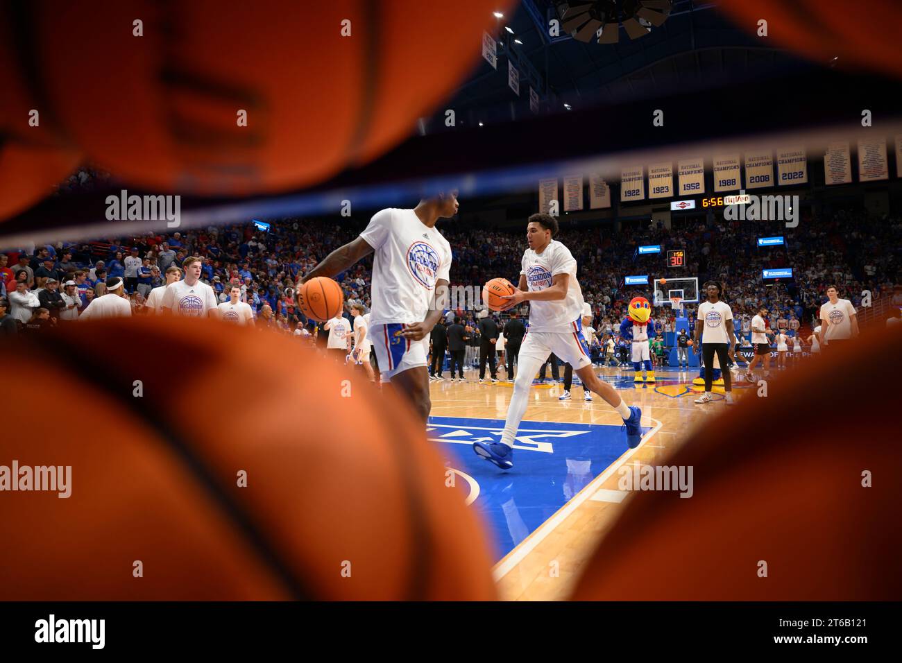 Kansas guard Kevin McCullar Jr., center, drives towards the basket ...