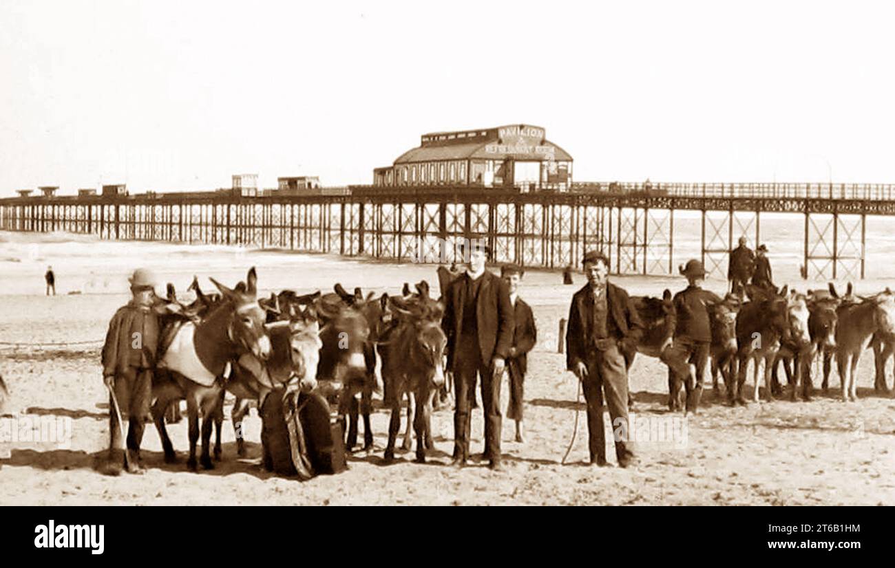 Rhyl donkeys on the beach and pier, early 1900s Stock Photo - Alamy
