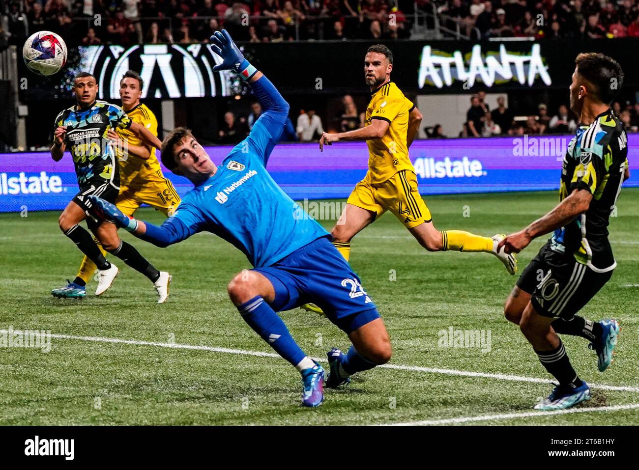 Columbus Crew goalkeeper Patrick Schulte (28) misses the ball as ...