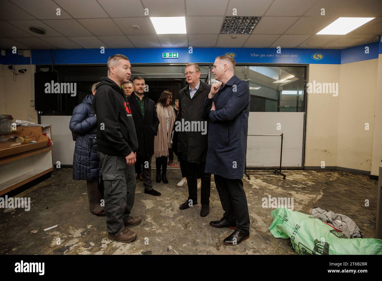 Lord Caine (second from right) listening to Gareth Latus (second from ...