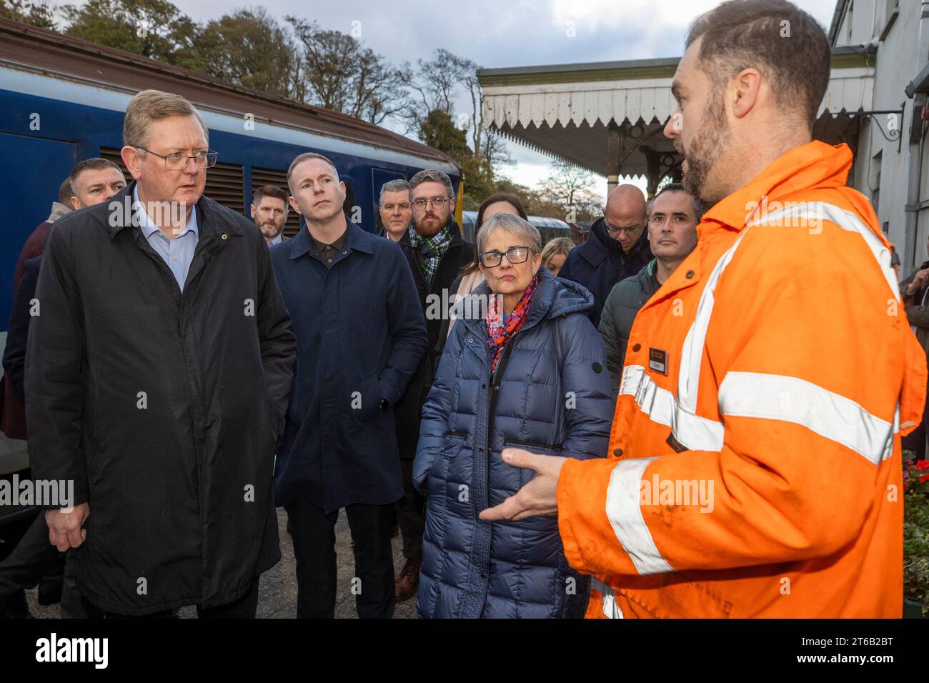 Lord Caine (second from left) listening to Robert Gardiner (right ...