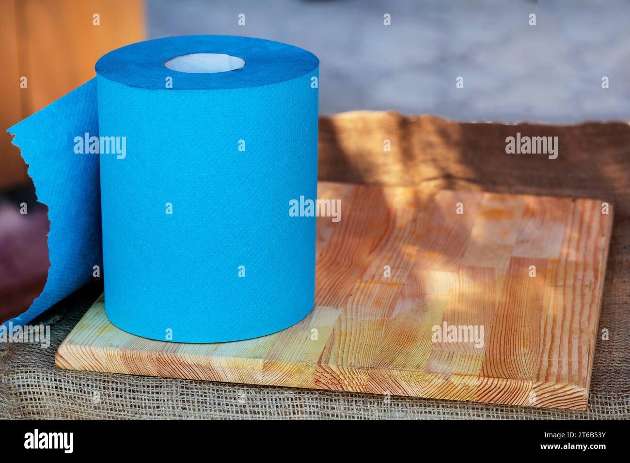 Paper napkins. Roll of paper towels. Kitchen Paper Towel on the wooden ...