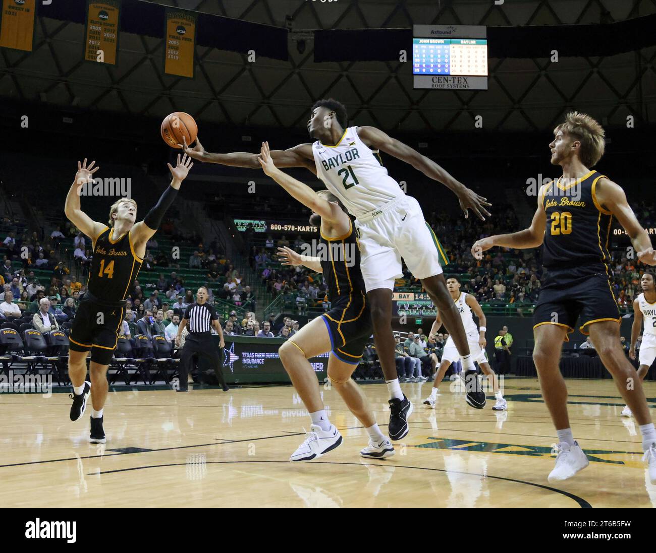 Baylor center Yves Missi (21) reaches for a loose ball with John Brown ...