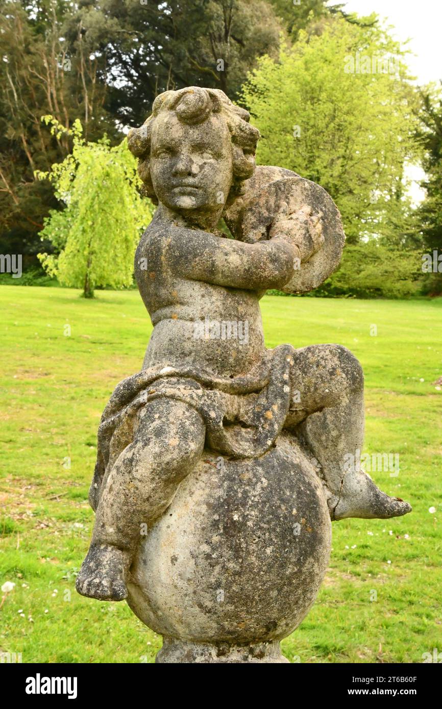 Statue of a child, Woodstock Gardens and Arboretum Stock Photo - Alamy