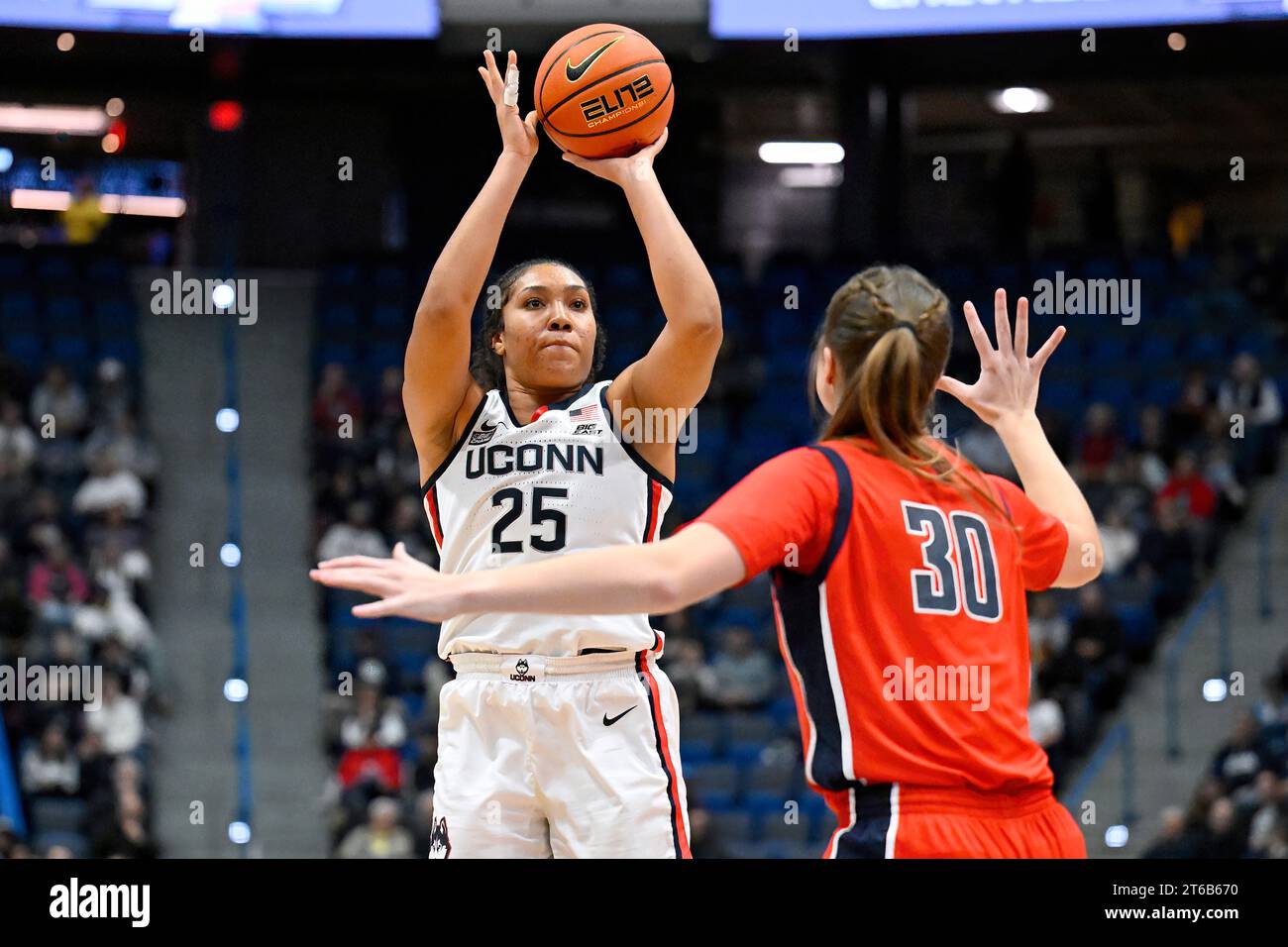 UConn forward Ice Brady (25) shoots over Dayton forward Riley Rismiller ...