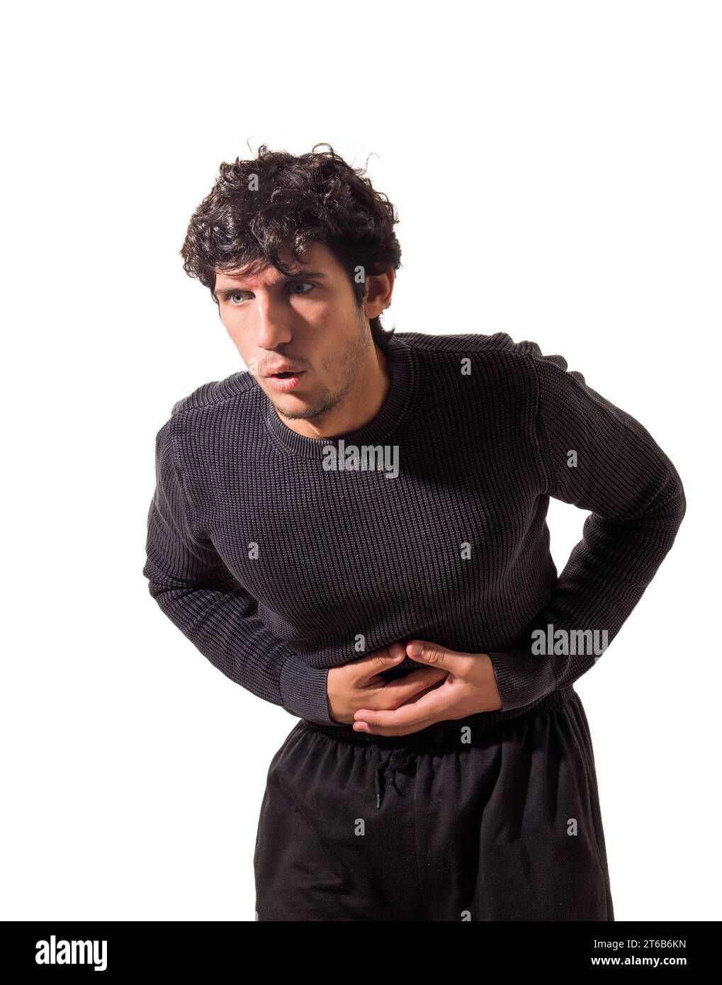 Confident Young Man Striking a Pose With His Hands on His Stomach ...