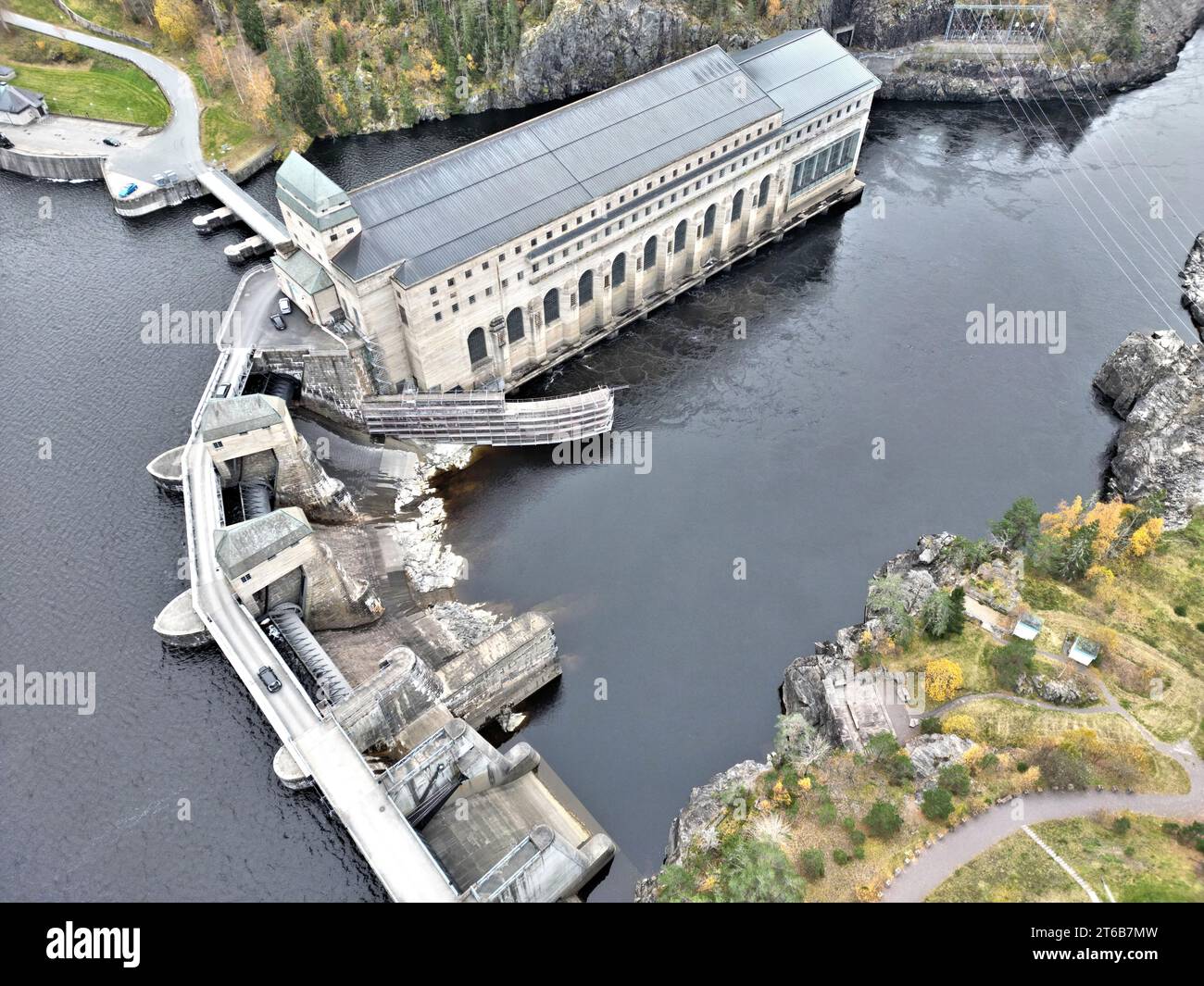 An aerial view of a bridge spanning over a body of water, featuring a ...