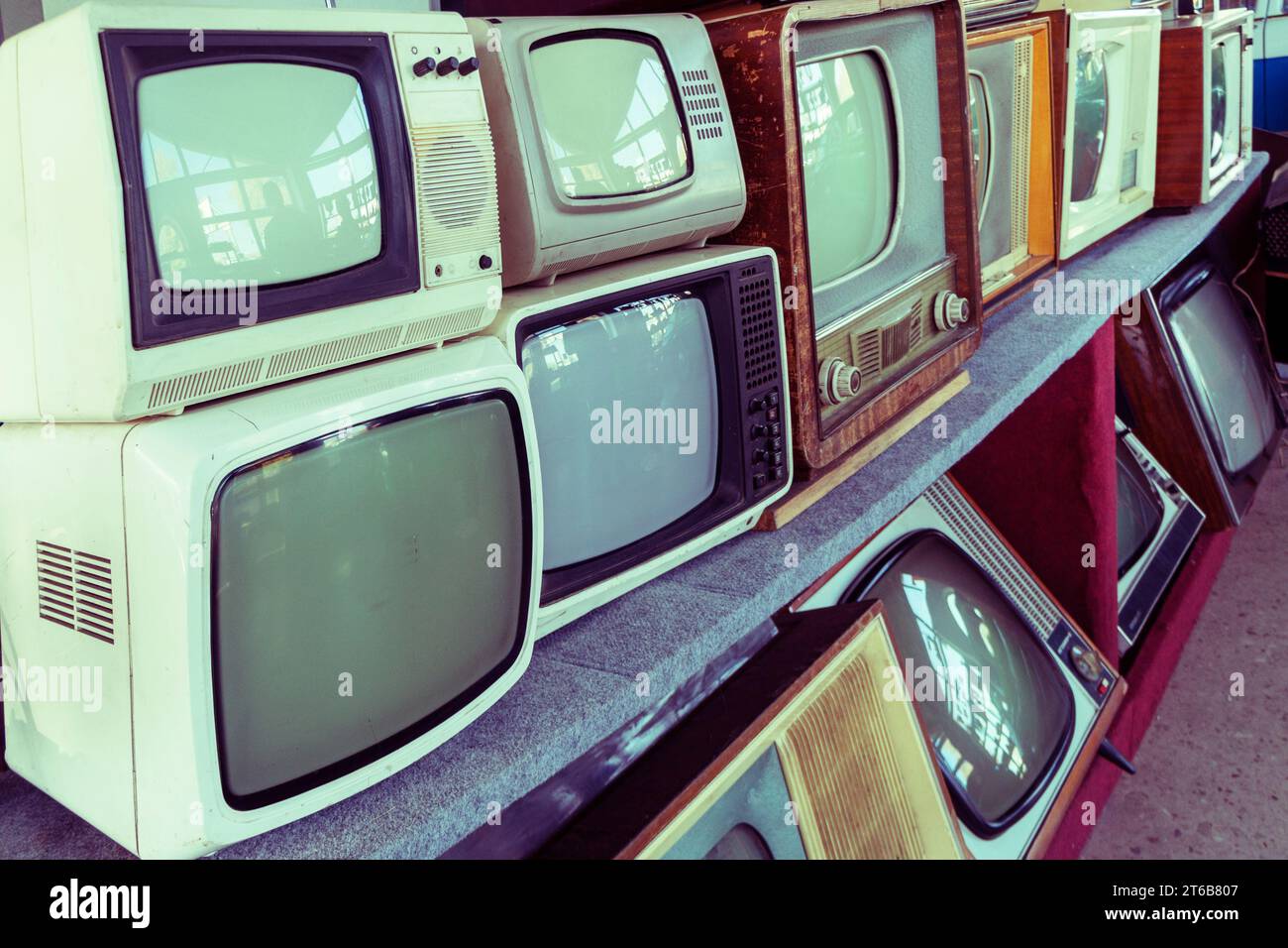 Many retro television. vintage old TV is colorful multi-row. Seeing the ...