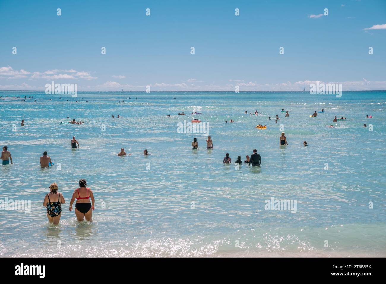 Honolulu, Oahu, HI, US-October 29, 2023: People swimming on the famous ...