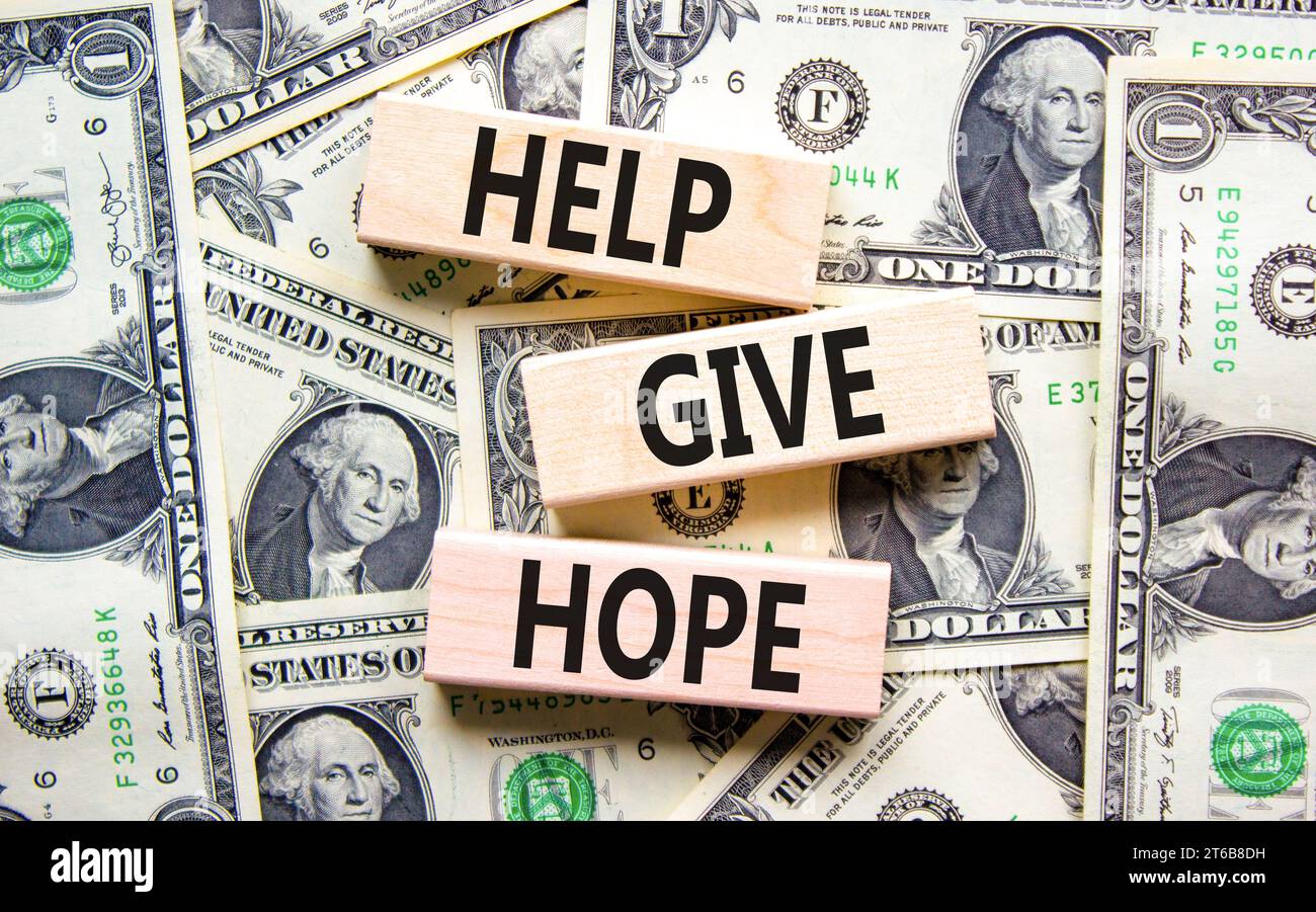 Help give hope symbol. Concept word Help give hope on beautiful wooden ...