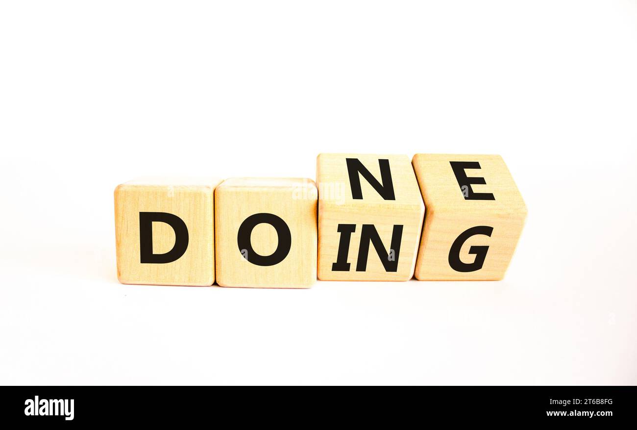 Doing and done symbol. Concept words Doing Done on wooden block ...