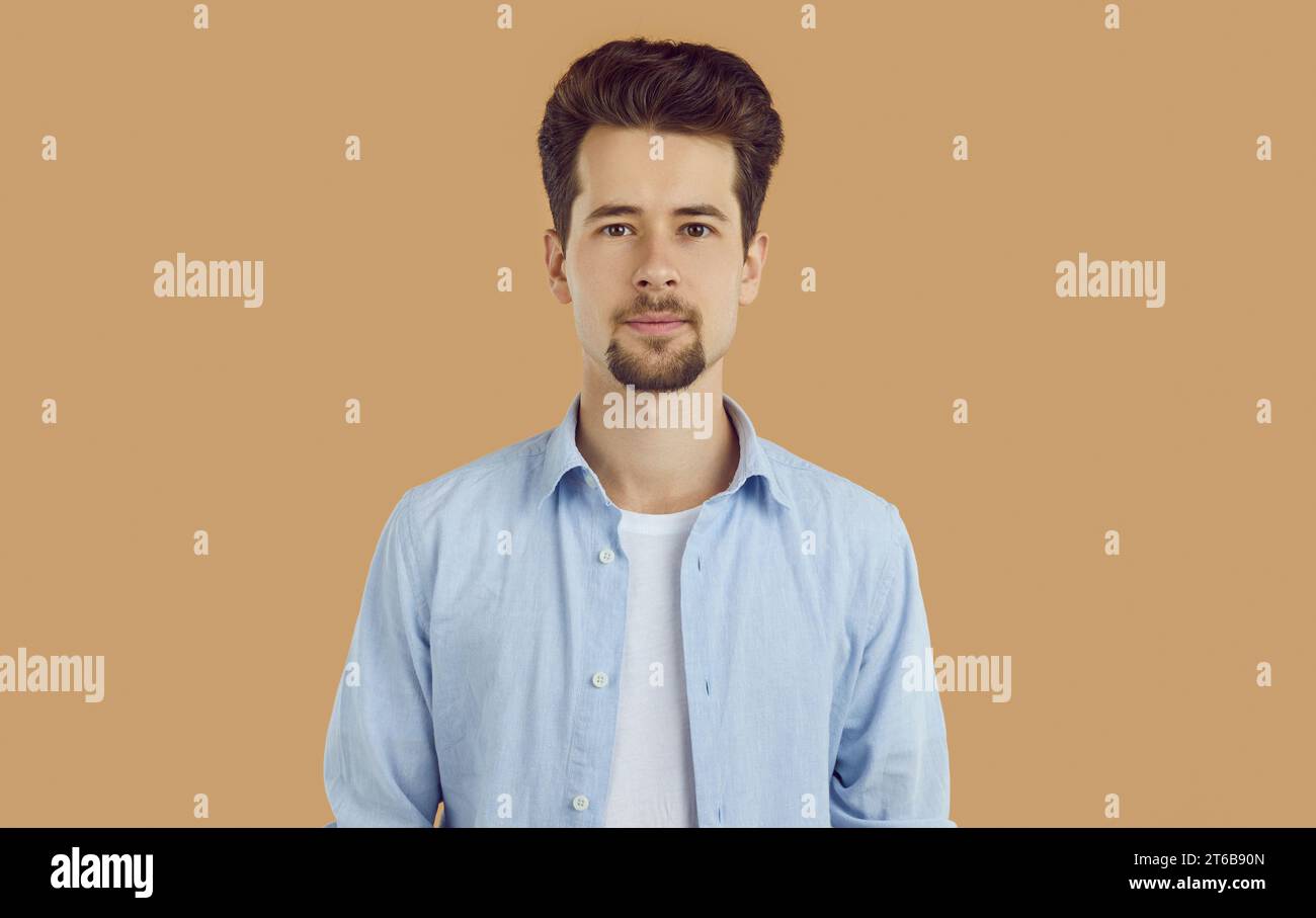Portrait of smiling young man with neatly shaved beard and mustache ...