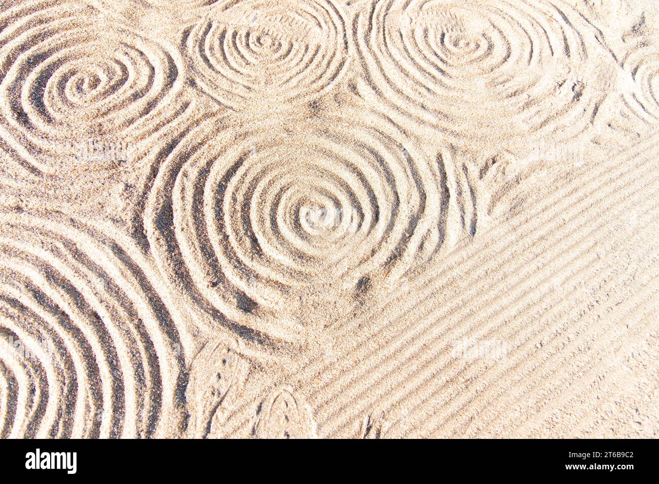 A stunning beach scene featuring pristine, white sand with circular ...