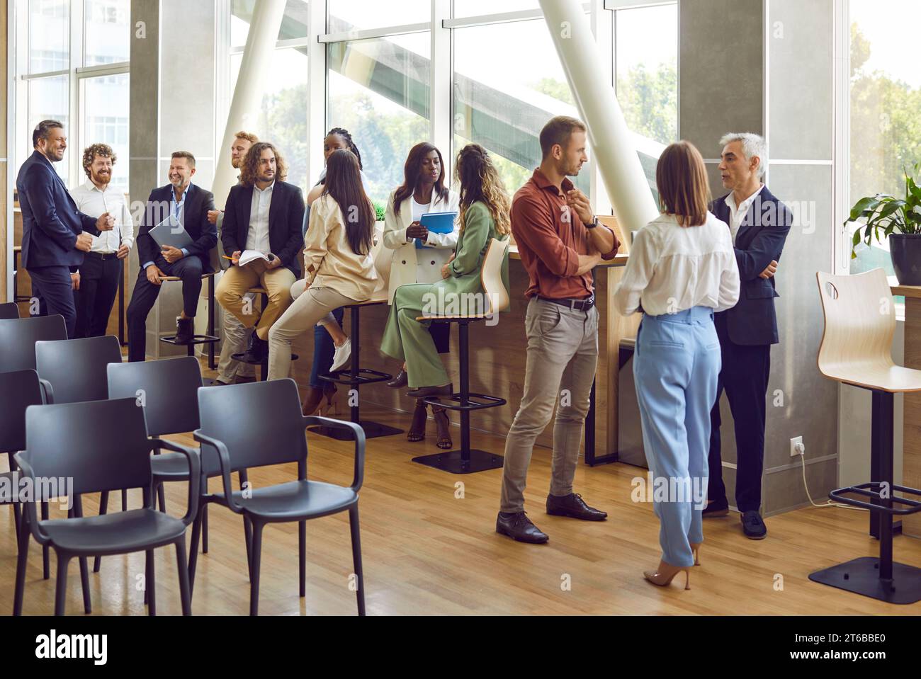 Group of diverse business people chatting after meeting standing in ...