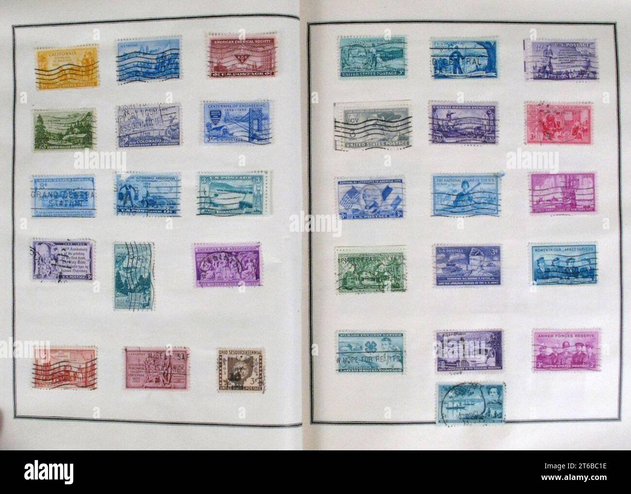 US postage stamps on album pages-5 Stock Photo - Alamy