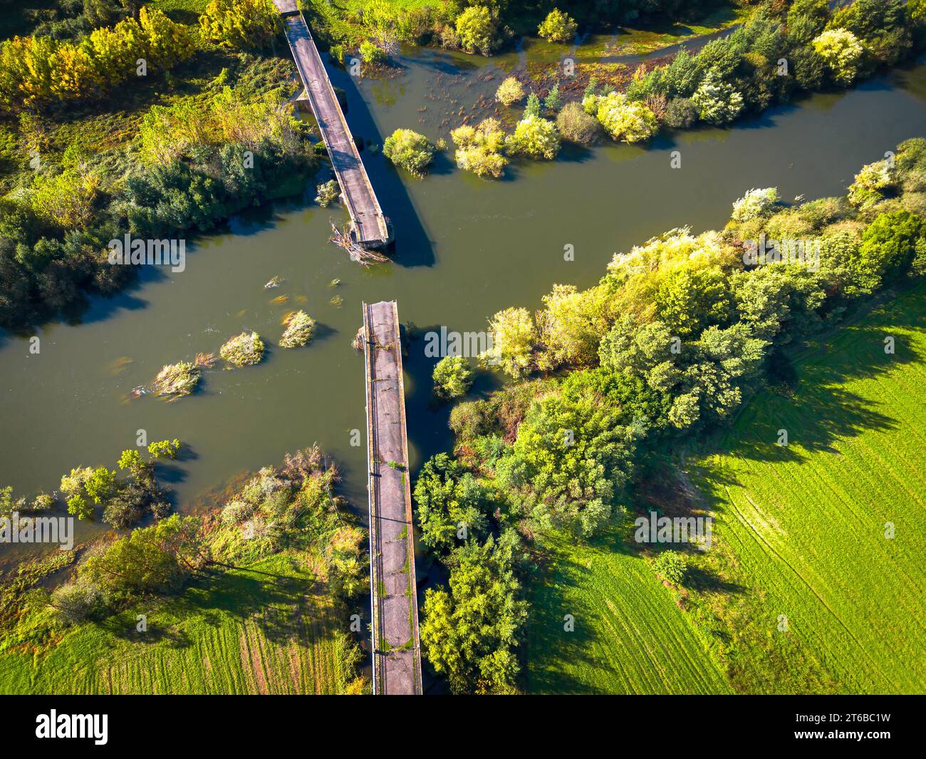 Broken bridge over the river Stock Photo - Alamy