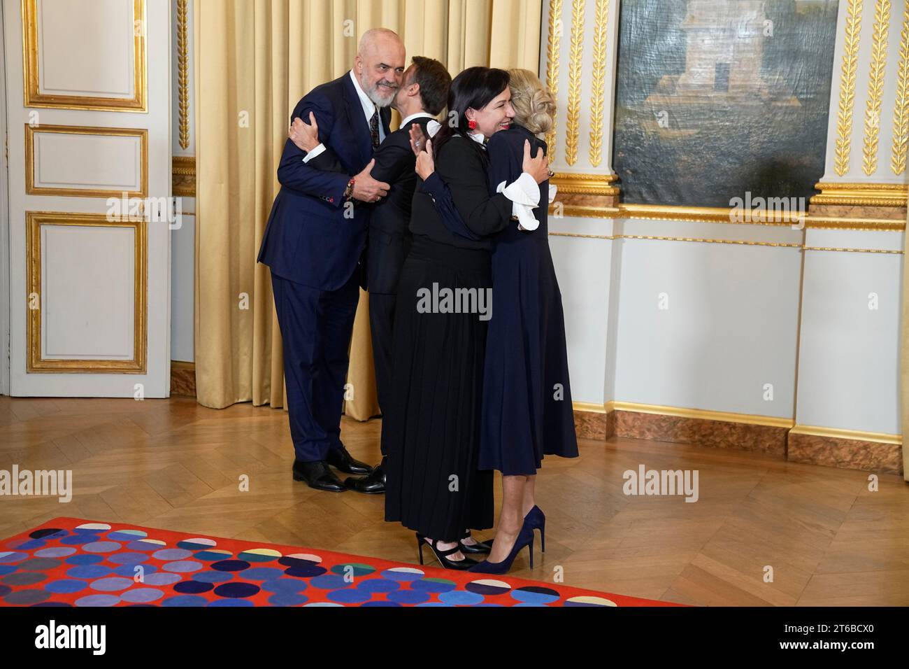 French President Emmanuel Macron, center, and his wife Brigitte Macron ...
