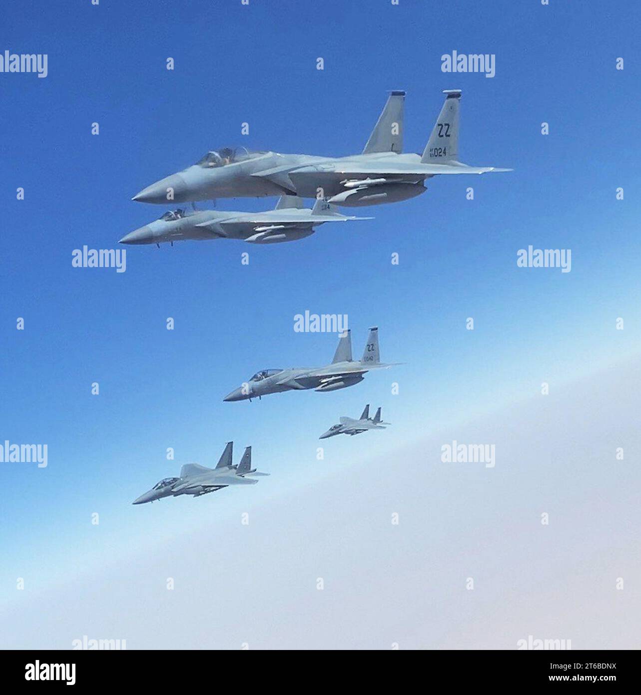USAF F-15C's from the 44th EFS fly in formation with RSAF F-15SA's ...