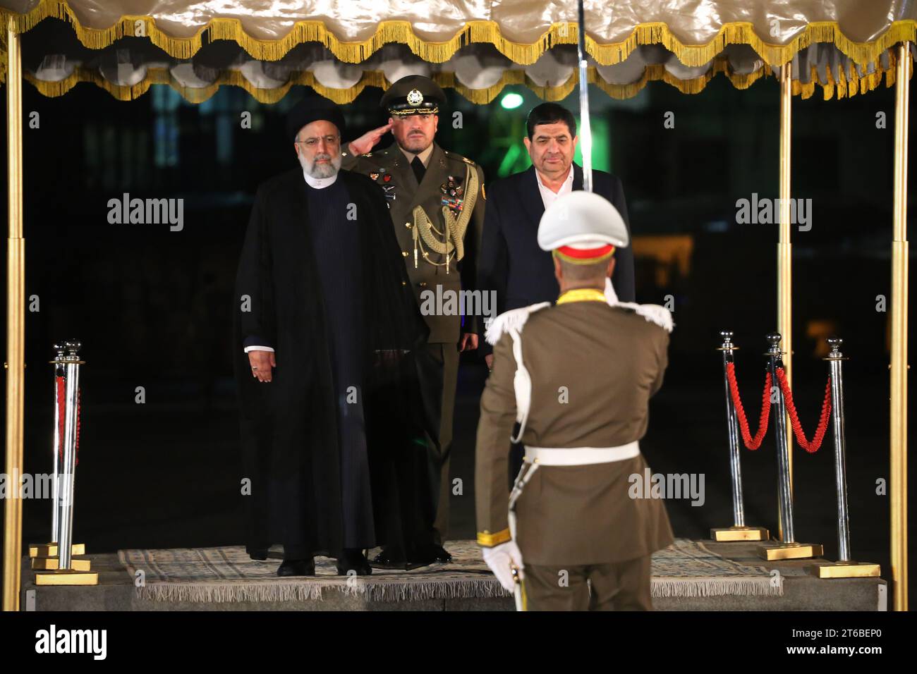 Tehran, Iran. 9th Nov, 2023. Iranian President EBRAHIM RAISI (L) stands ...
